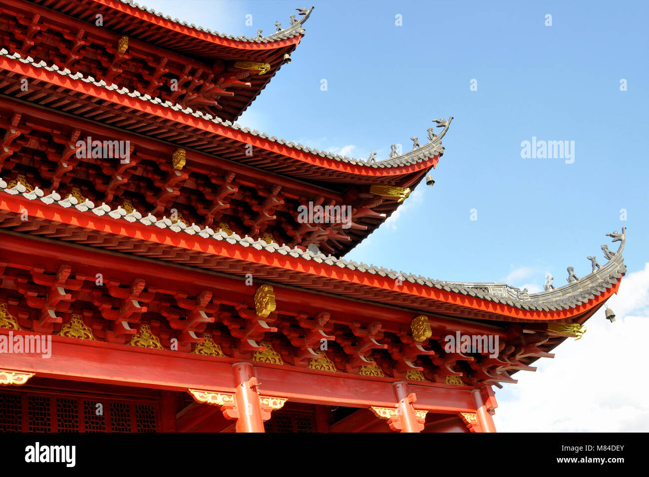 Chinese style temple roof against blue sky background Stock Photo - Alamy