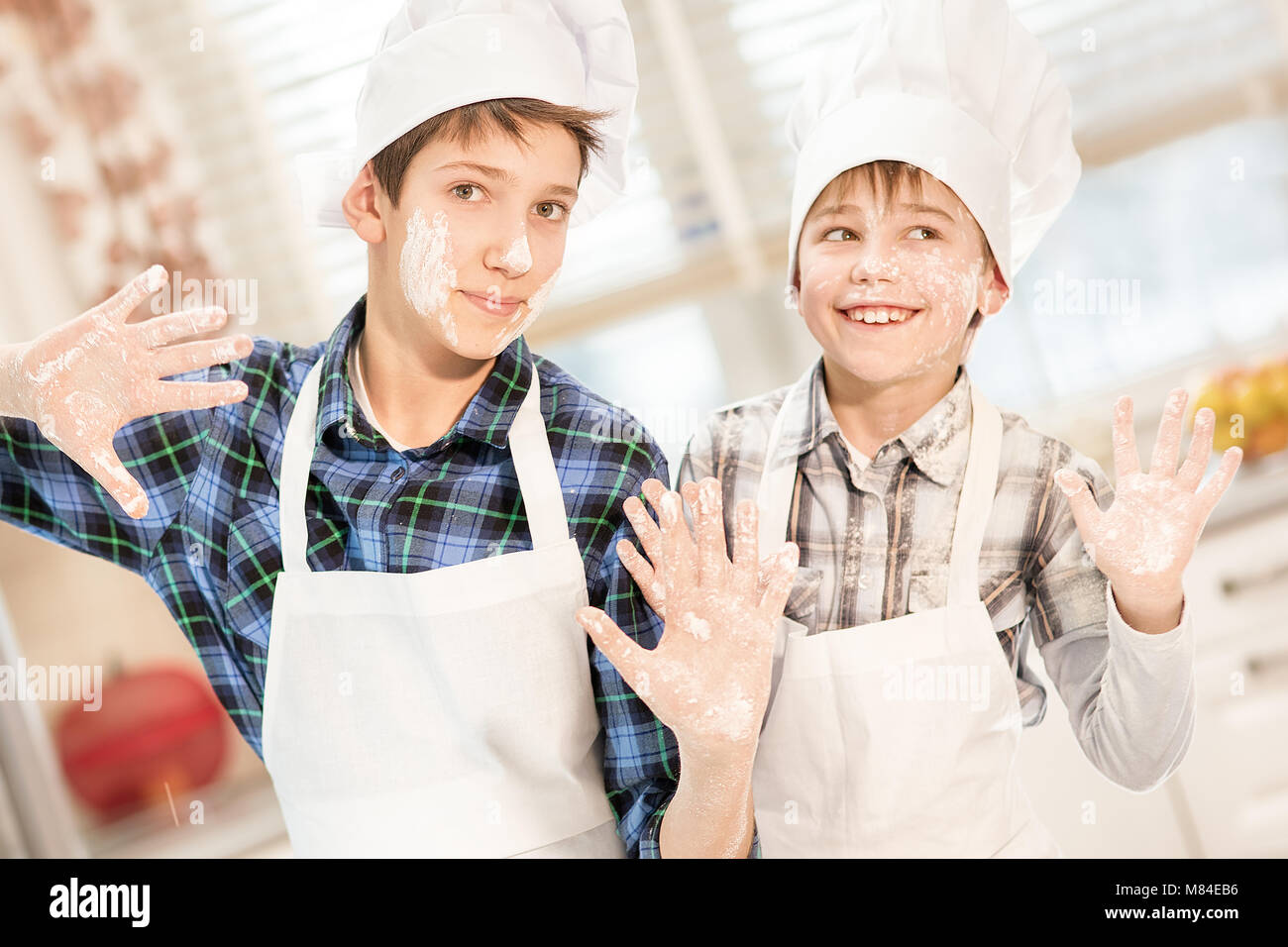 Kids making mess in kitchen hi-res stock photography and images - Alamy