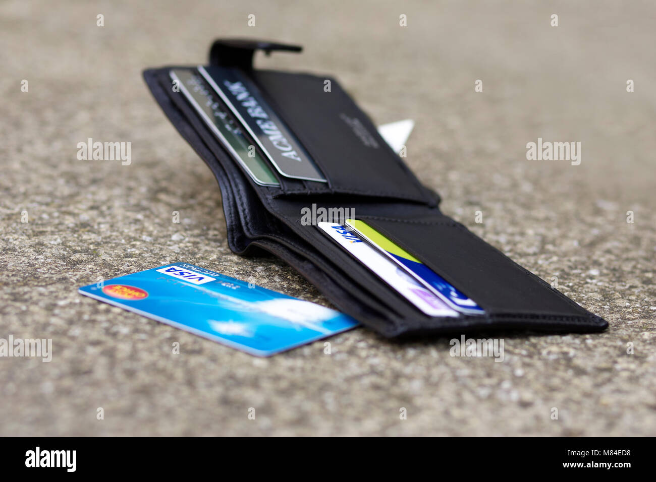 Dropped wallet laid on the floor Stock Photo - Alamy