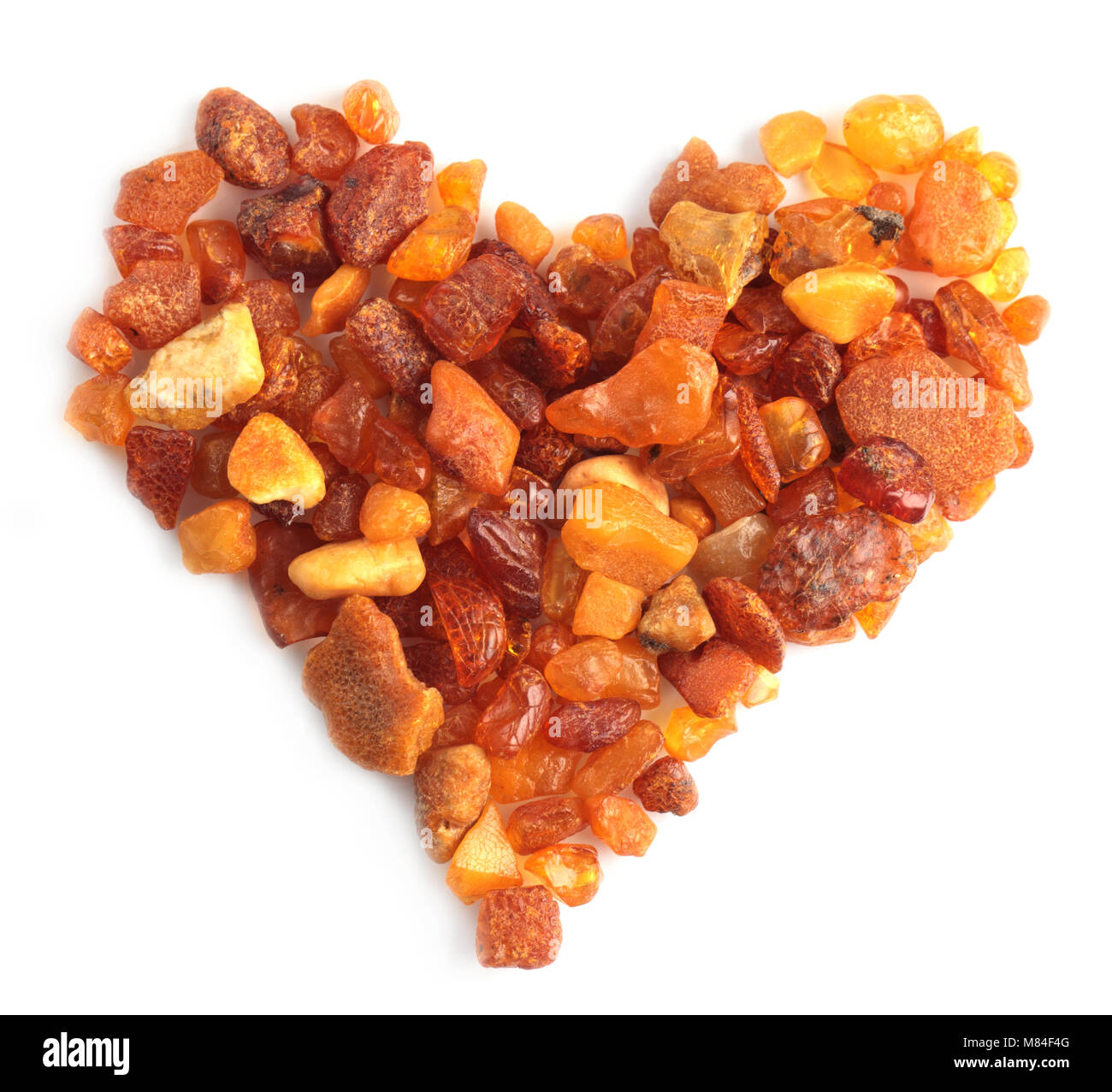 Heart-shaped pieces of amber against white background Stock Photo - Alamy