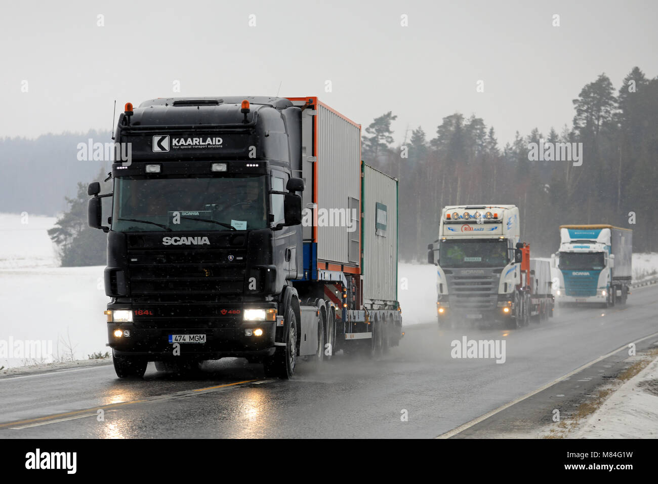 SALO, FINLAND - MARCH 9, 2018: Two special transport semi trucks and a ...