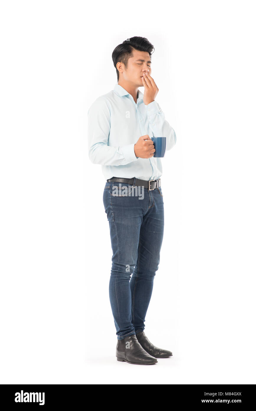 Sleepy young man yawning Cut Out Stock Images & Pictures - Alamy