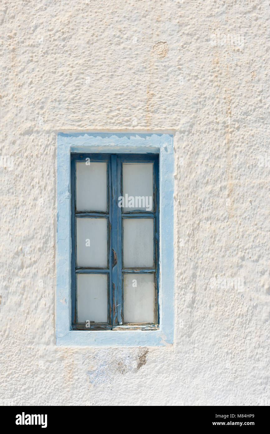 Just a blue window frame against a cream backdrop on the island of ...