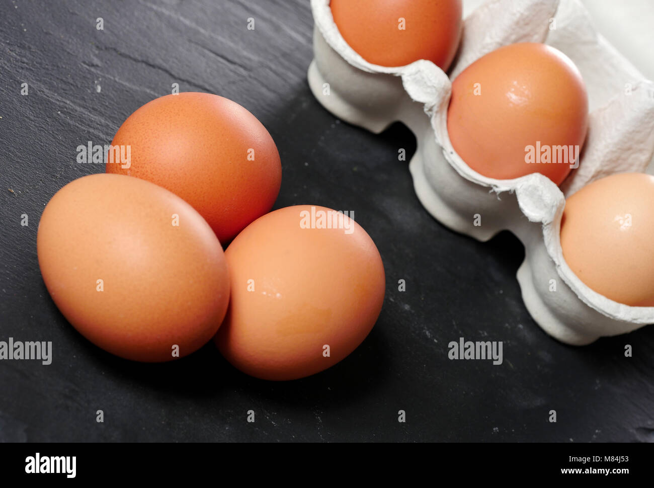 Eggs in the egg panel, close up Stock Photo - Alamy