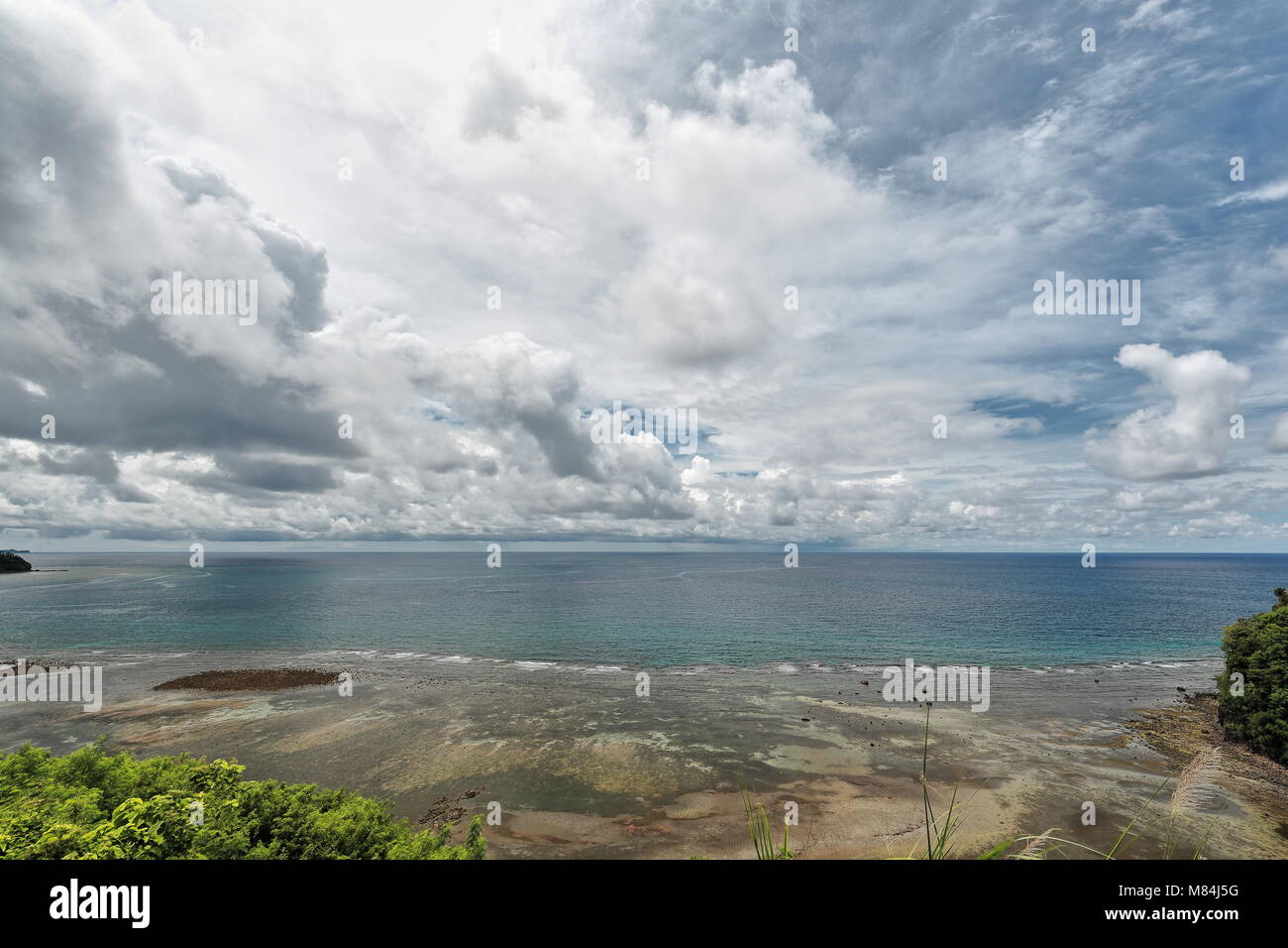SW-wards view to Danjugan Island Marine Reserve over the coastal coral ...