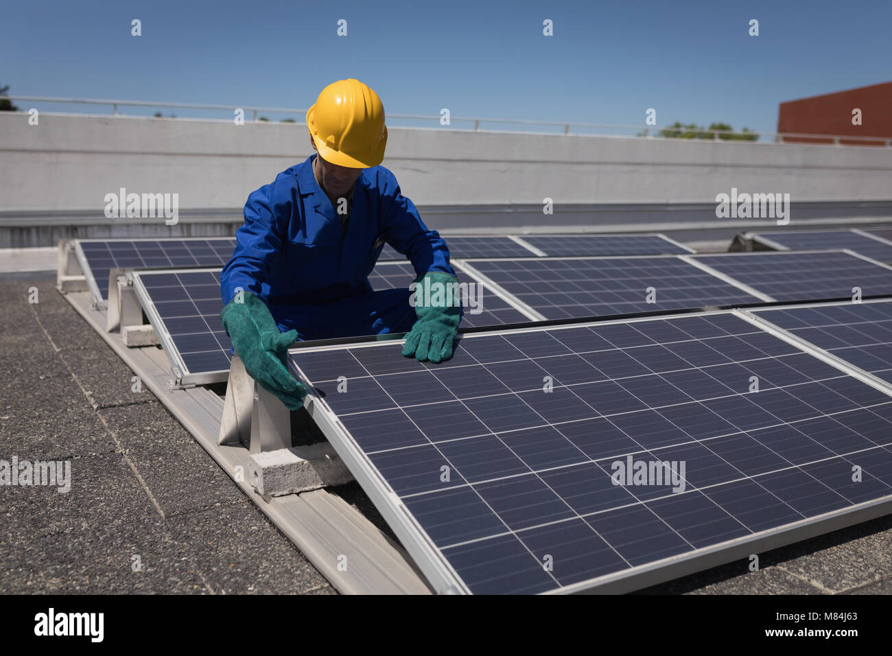 Male worker working at solar station Stock Photo - Alamy