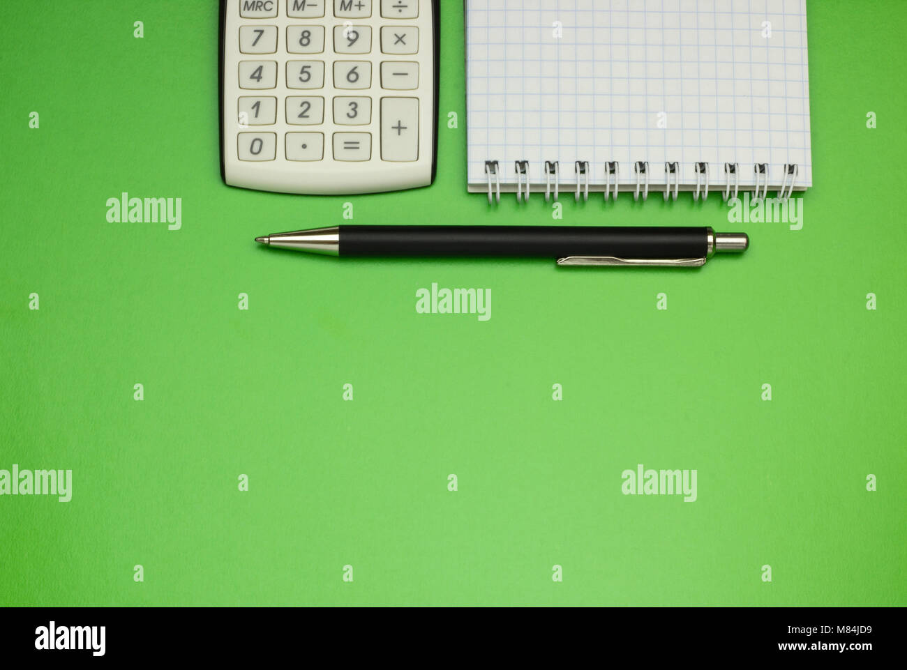 Top view office table calculator with pen on the table for business and ...