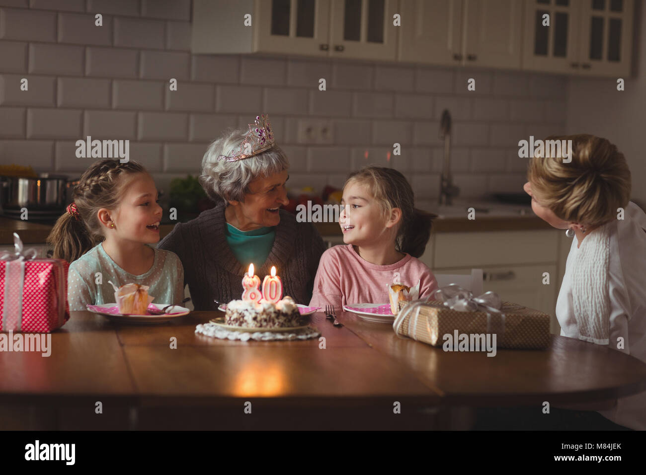 Grandmother celebrating her birthday with her family Stock Photo - Alamy