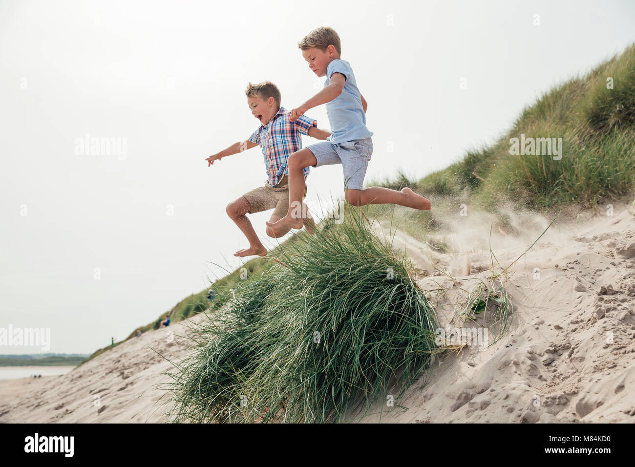 Boys jumping into hi-res stock photography and images - Alamy
