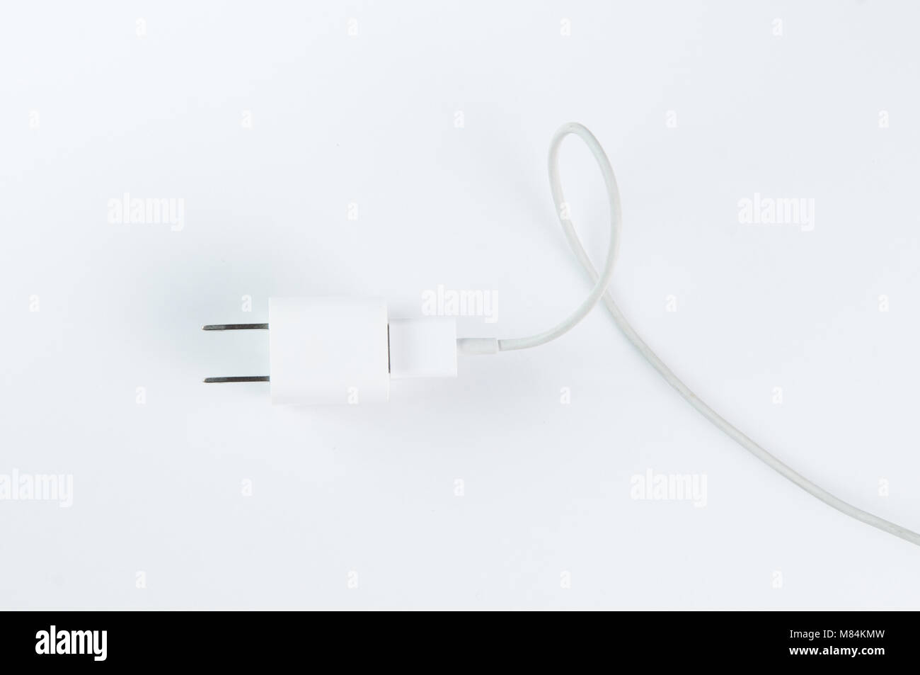 white charging cord on a white background Stock Photo - Alamy