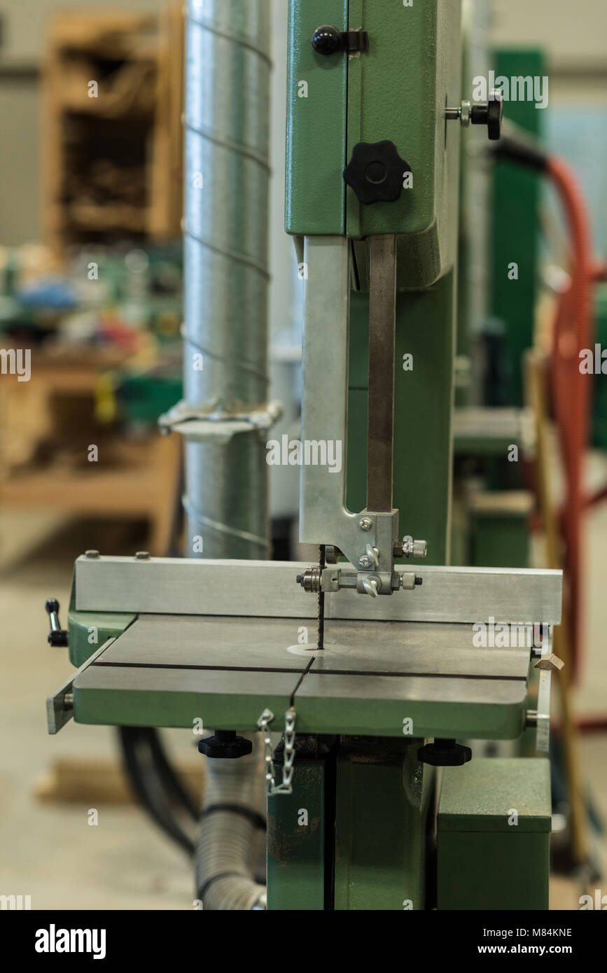 Vertical cutter machine at workshop Stock Photo - Alamy