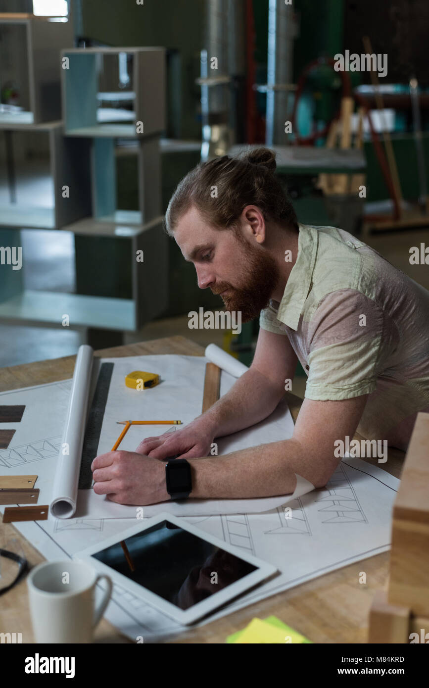 Male carpenter working at workshop Stock Photo - Alamy