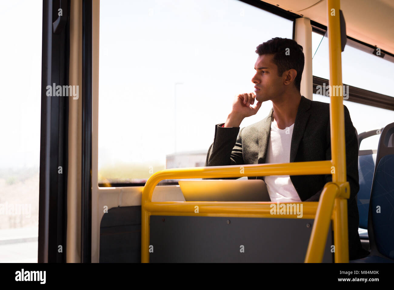 Businessman travelling in bus Stock Photo - Alamy