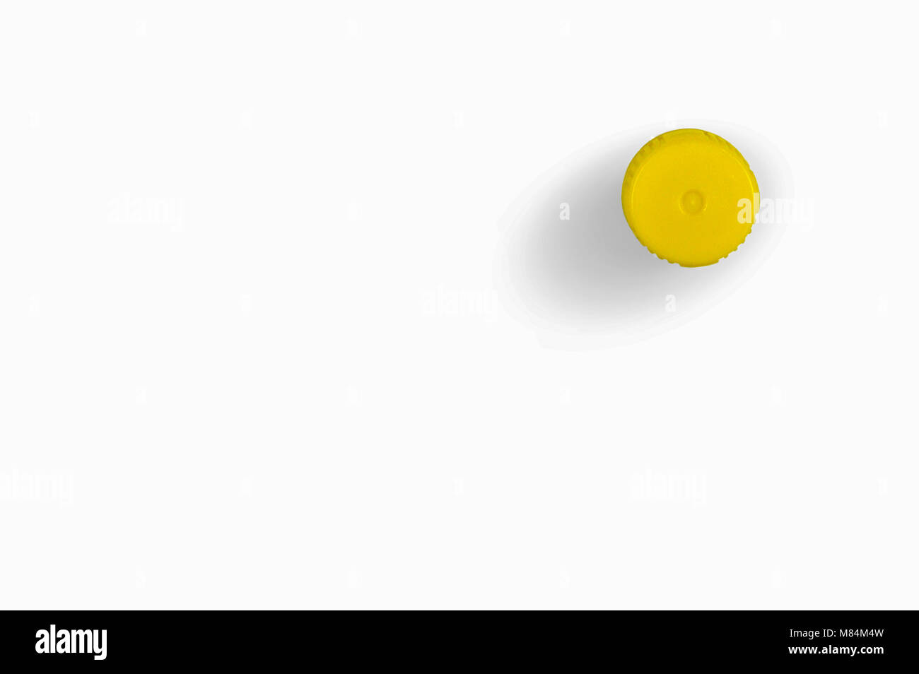 a yellow plastic plug isolated on a white background Stock Photo - Alamy