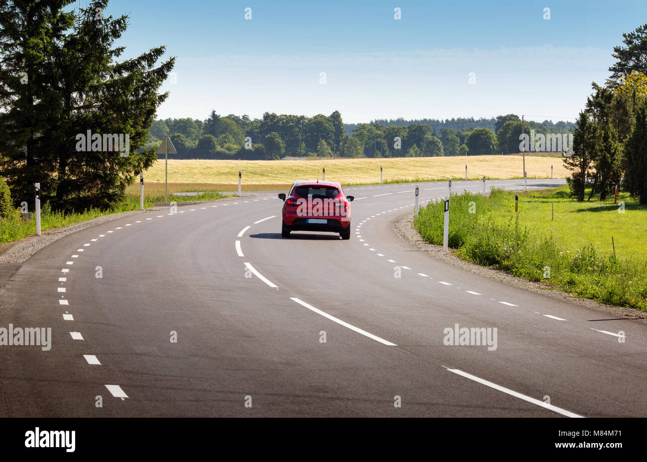 Car on asphalt road in beautiful spring day Stock Photo - Alamy