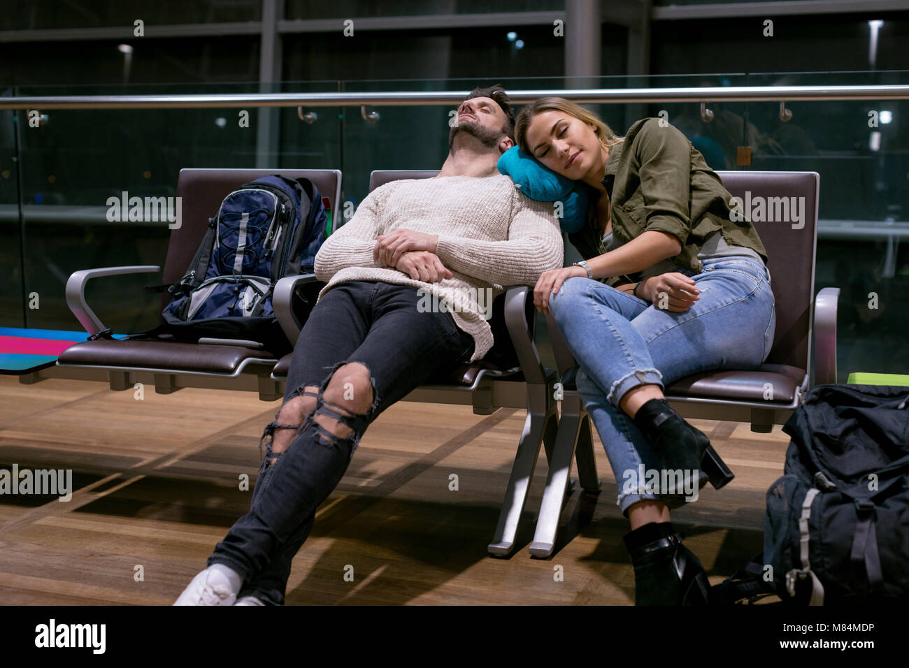 Woman sleeping in flight hi-res stock photography and images - Alamy