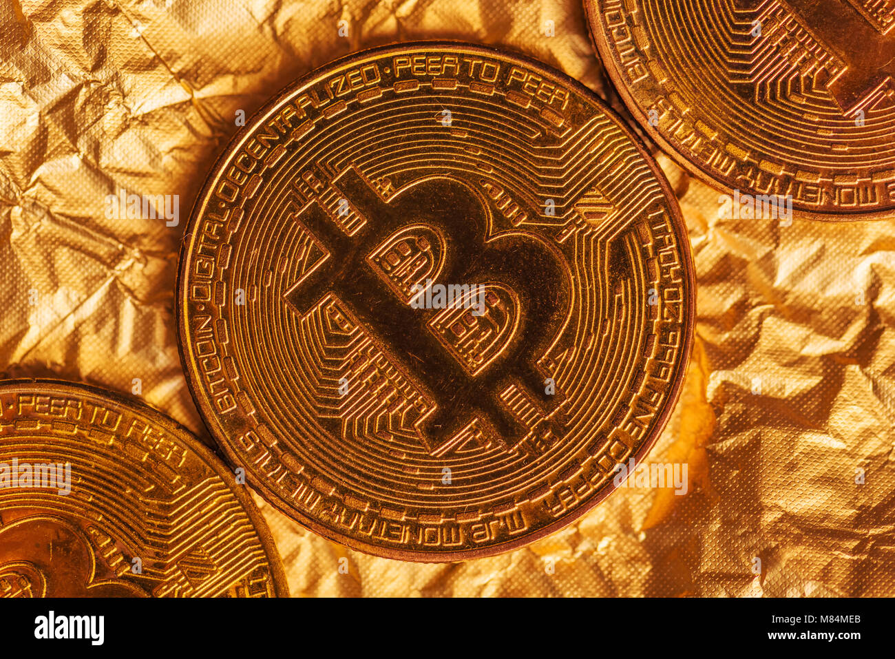 Bitcoin, blockchain cryptocurrency golden coin on gold metal background ...