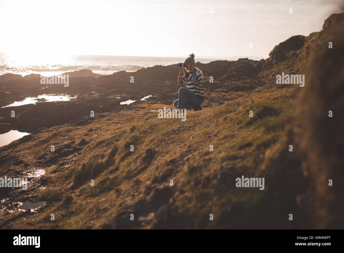 Pretty woman crouching camera hi-res stock photography and images - Alamy
