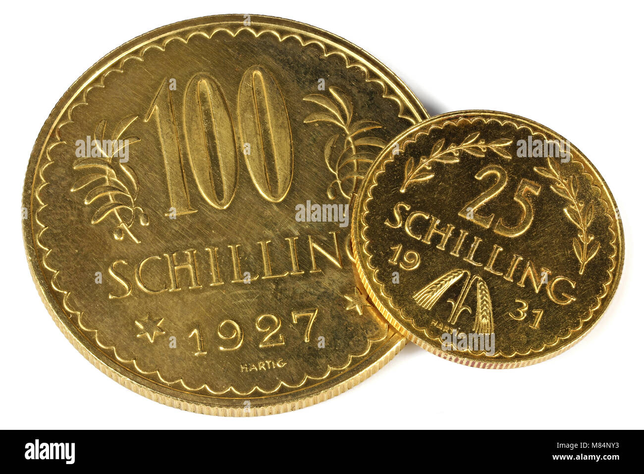 Austrian 25 and 100 Schilling gold coins isolated on white background ...