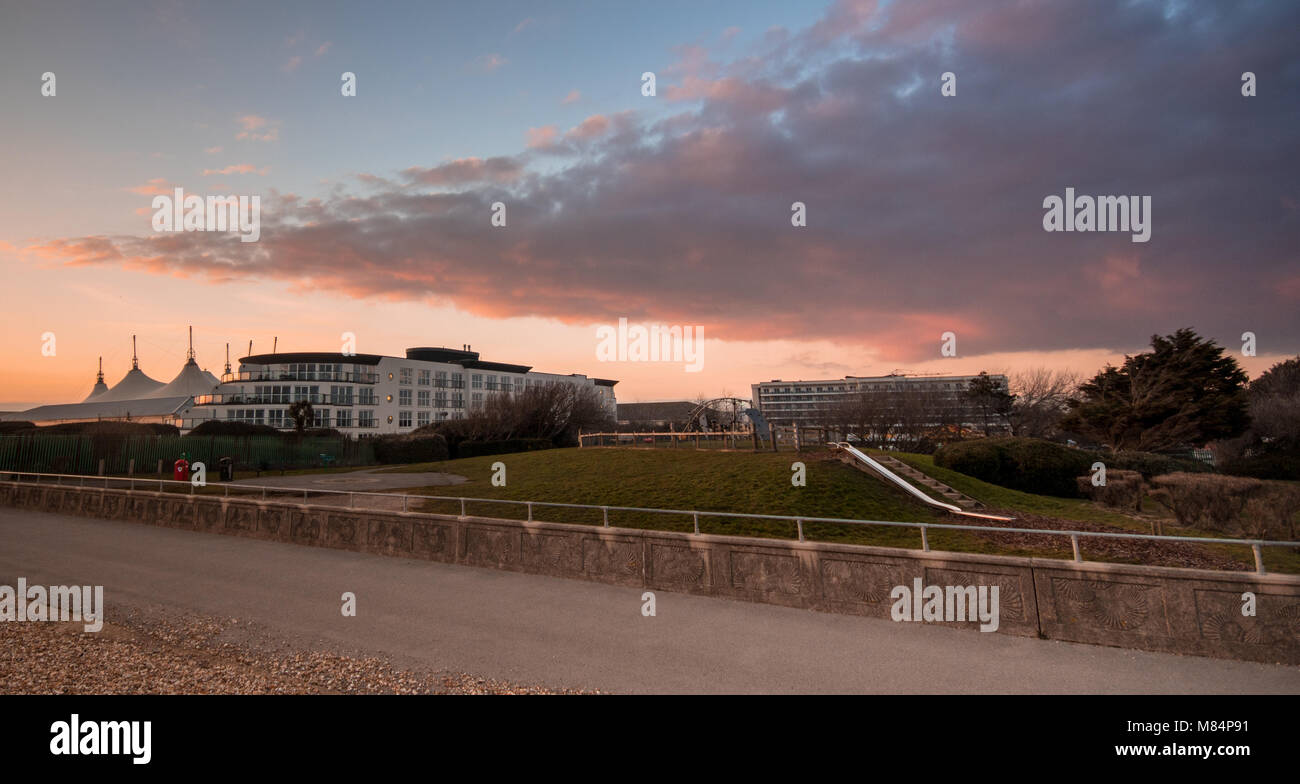 View of Ocean hotel, Butlin's against a red sky at dusk, Bognor Regis ...