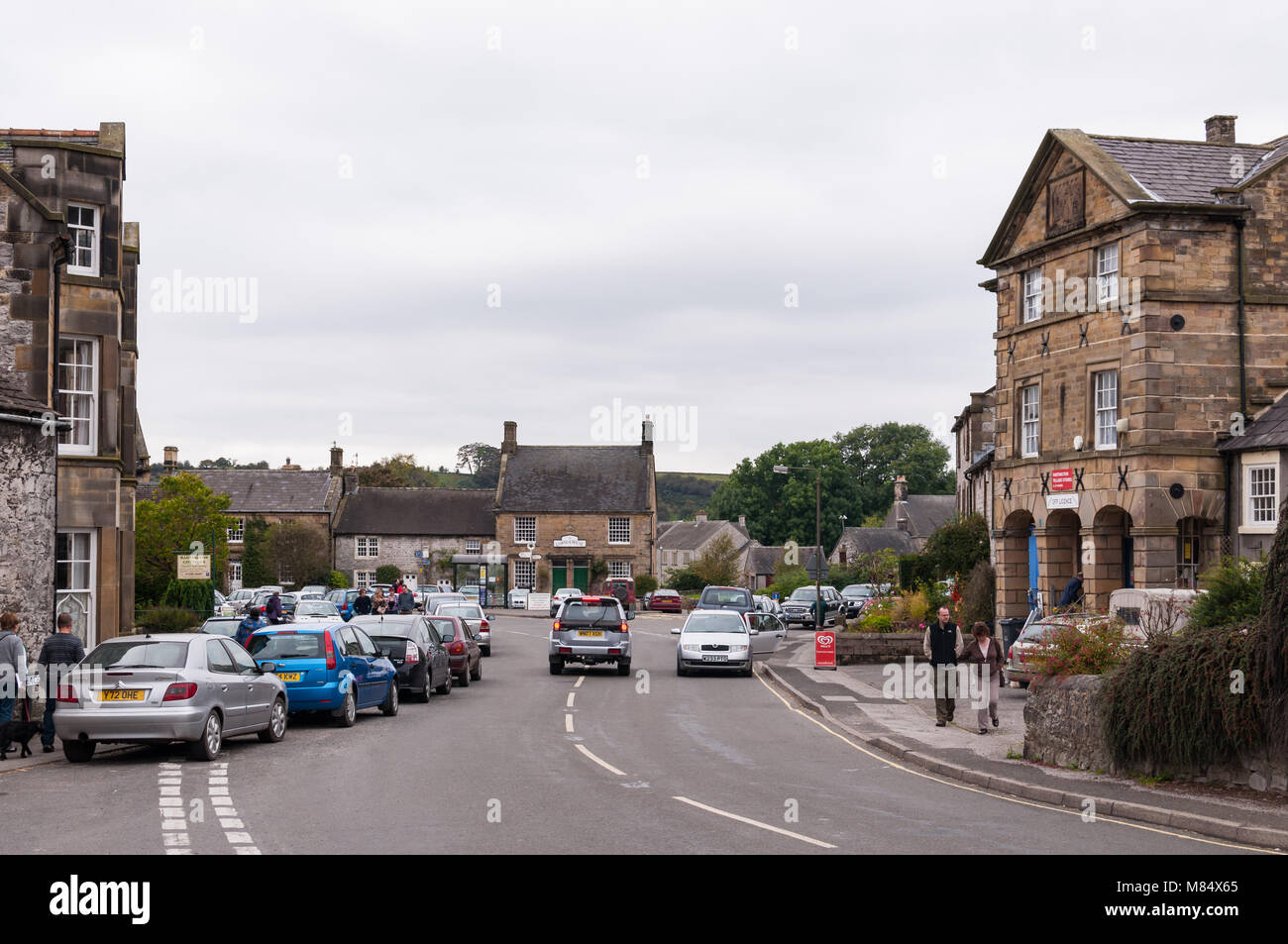 The village of Hartington in the Peak District with B5054 main road and ...