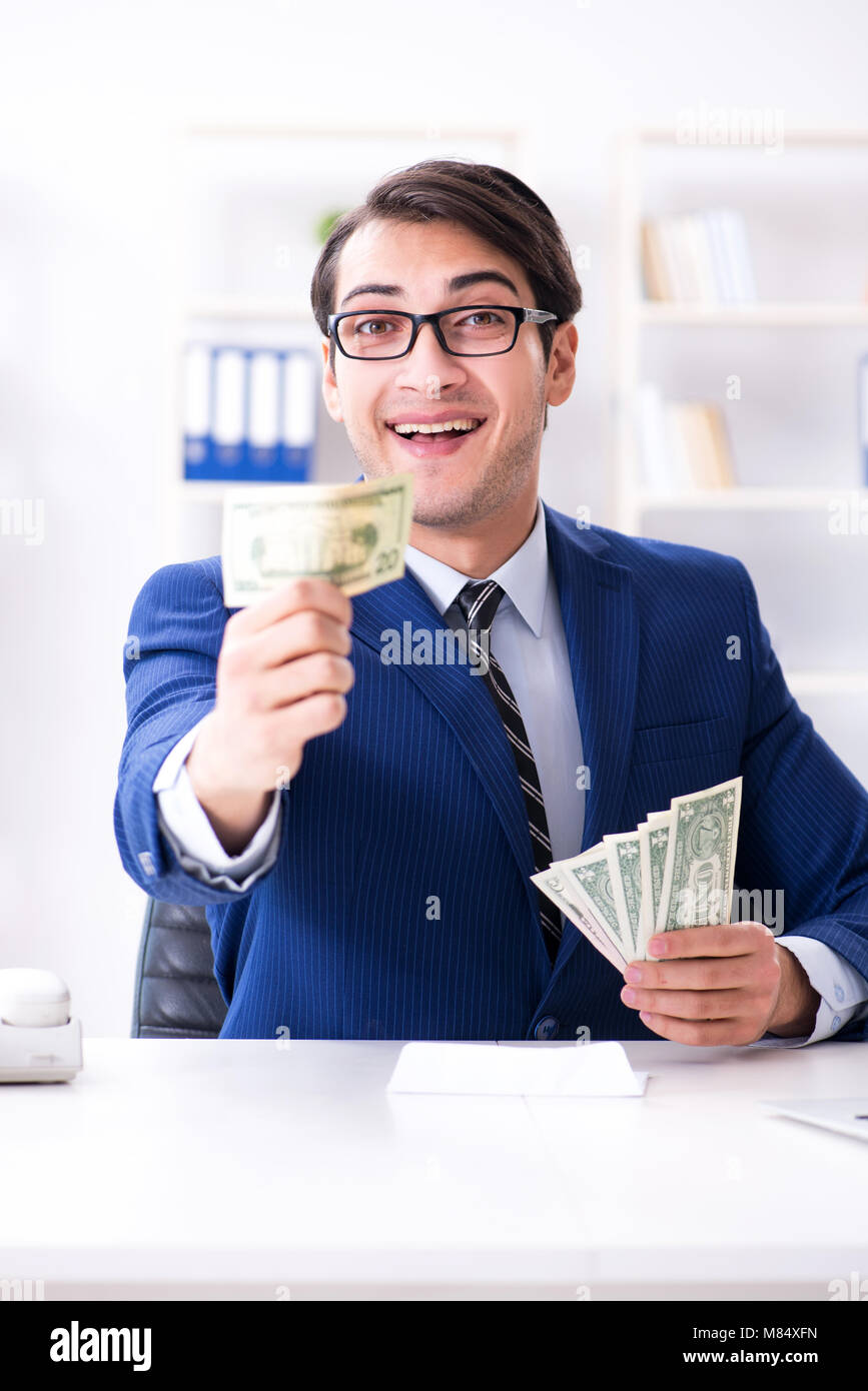 Businessman receiving his salary and bonus Stock Photo - Alamy