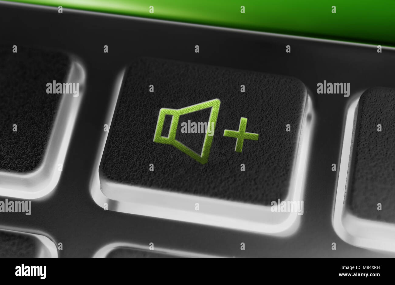 Macro Of A Black Volume Up Button Of A Black Remote Control With ...