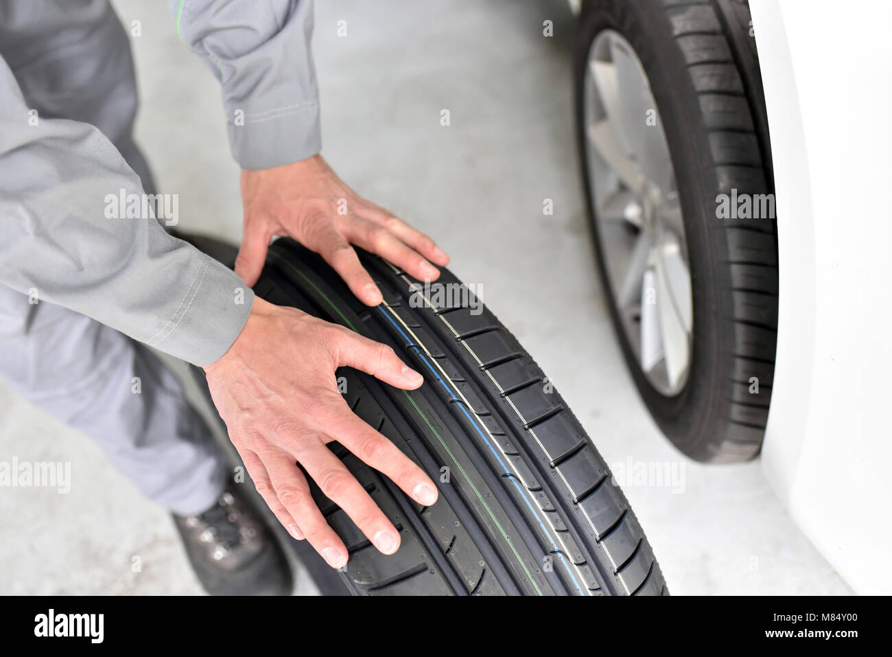 car tyre change in a workshop Stock Photo - Alamy