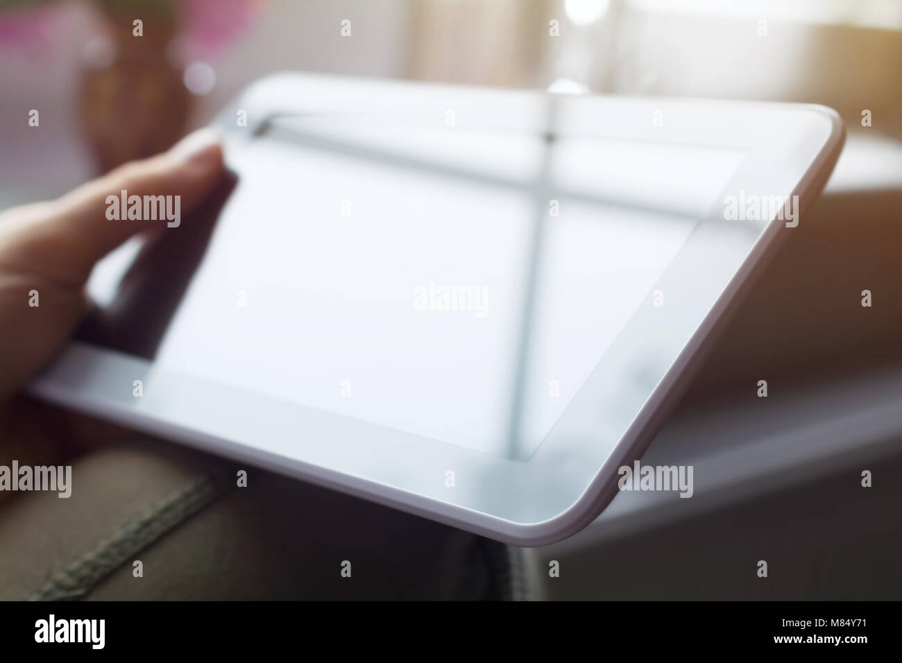 Female Holding White Business Tablet Next To A Window At Sunset Stock ...