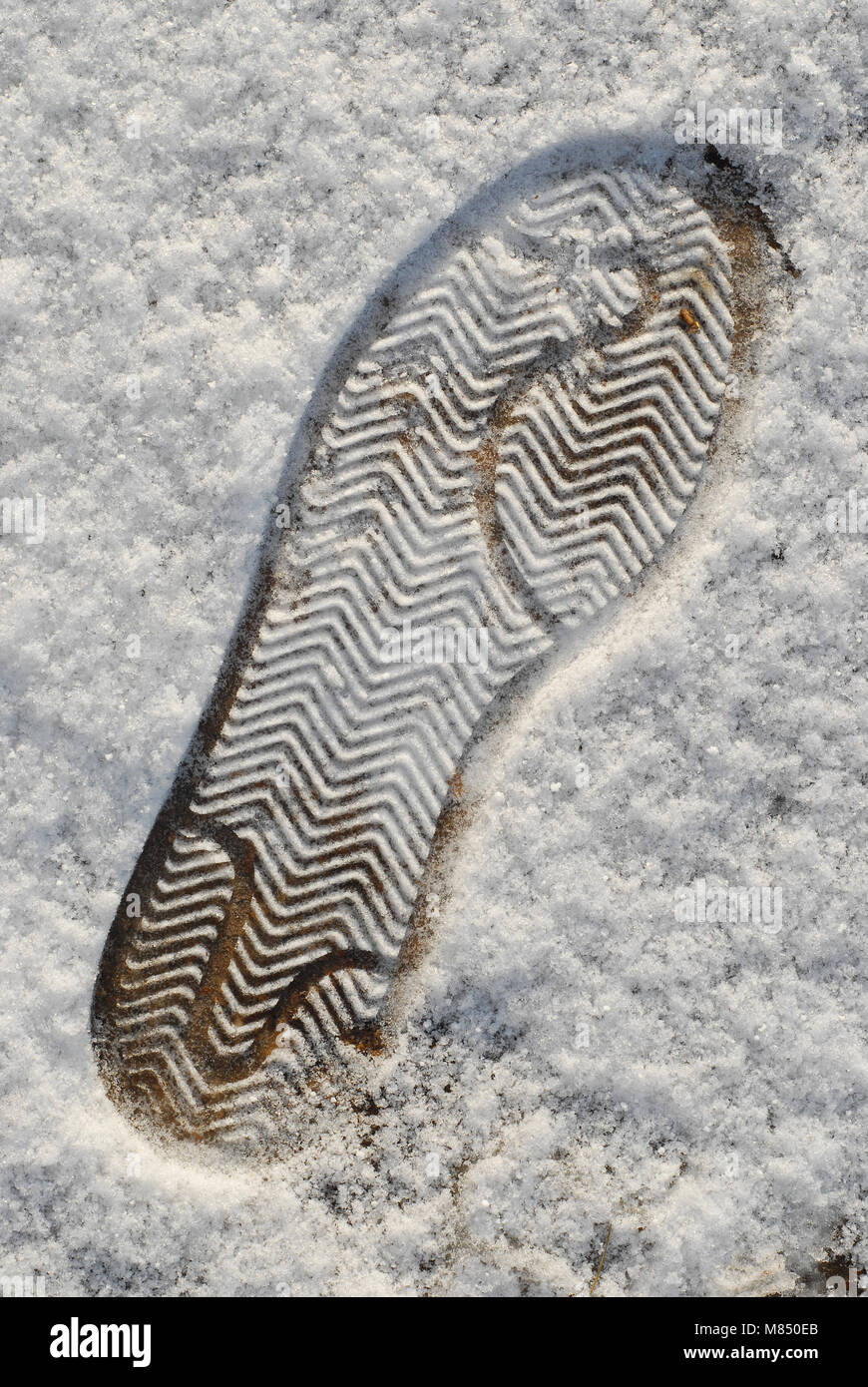 footprint pattern made by shoe in the snow Stock Photo - Alamy