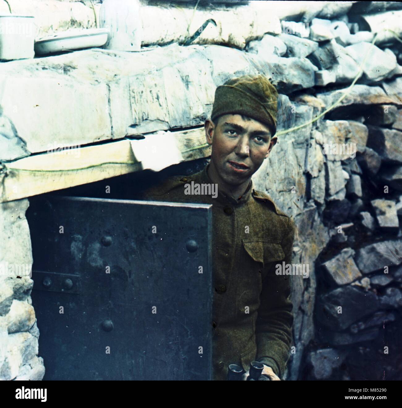 Colorized portrait of an American soldier standing in a bunker doorway ...