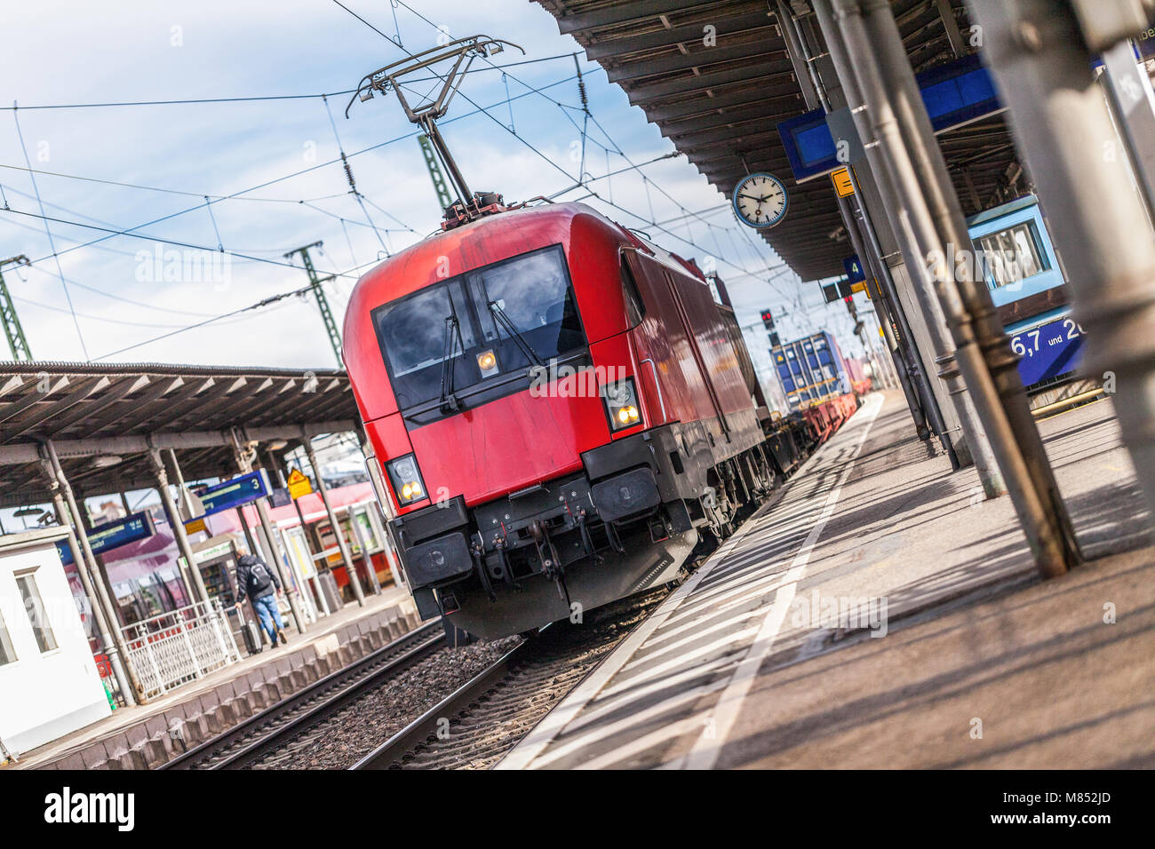 a german train passes a train station Stock Photo - Alamy