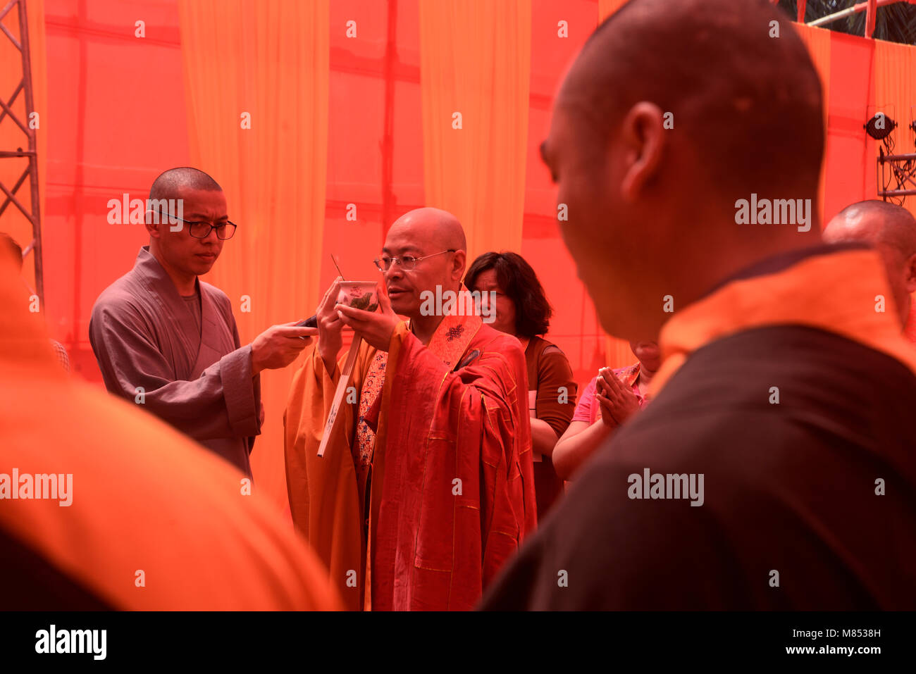 Kolkata, India. 14th Mar, 2018. Chinese Buddhist monk performs rituals ...