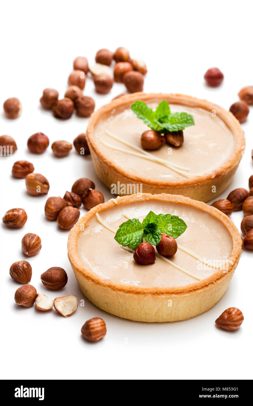 mini hazelnut and chocolate tarts isolated on white background Stock ...