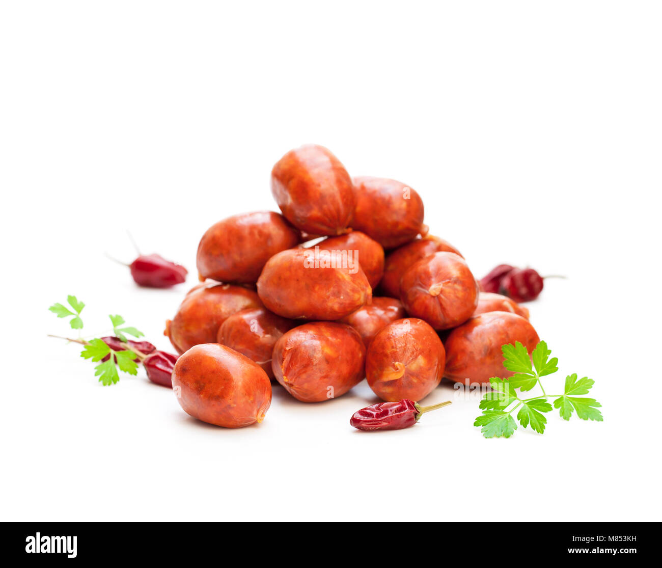 Strings of mini chorizo sausages with hot chili isolated on white Stock ...
