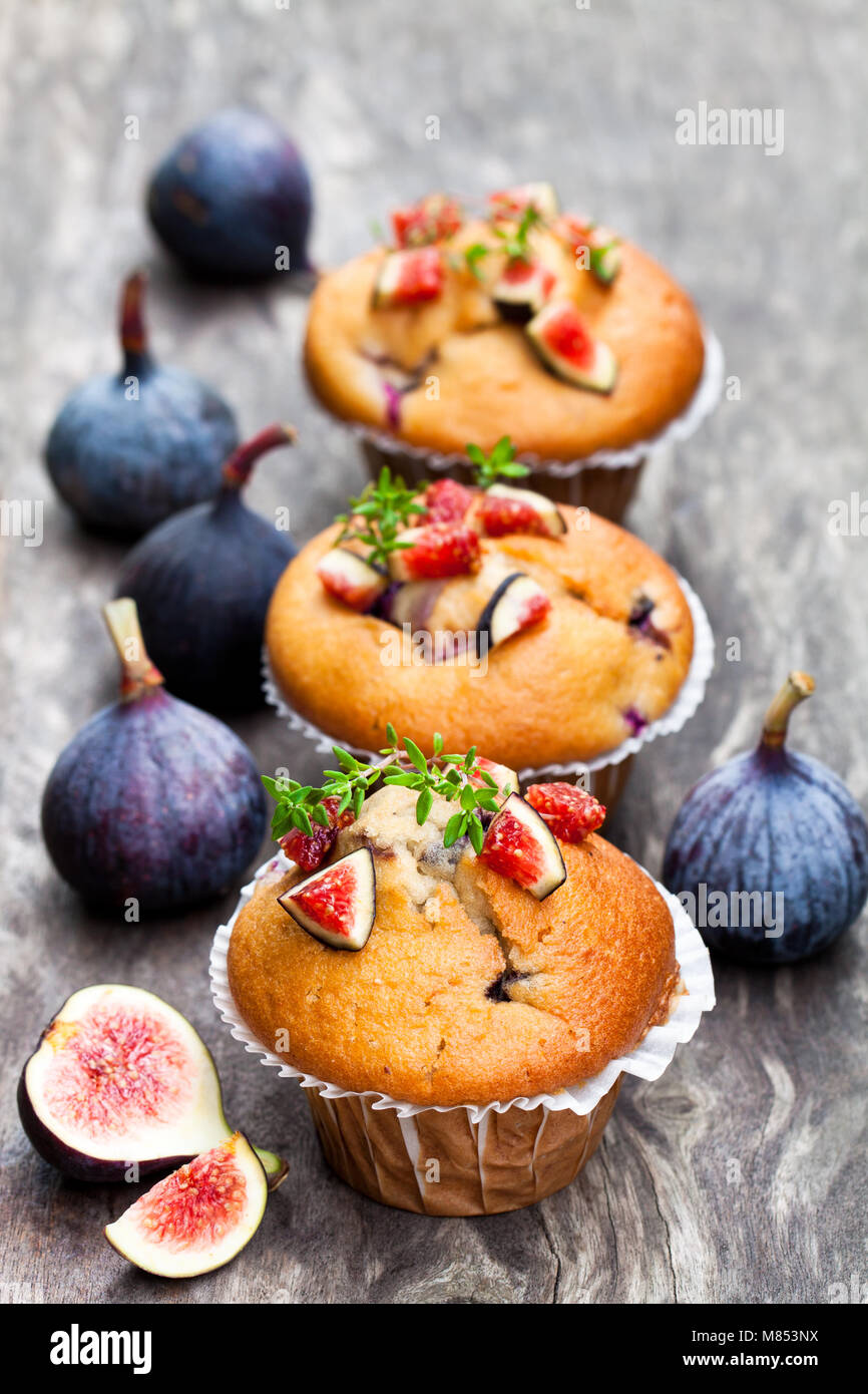Baked muffins with figs on rustic wooden table Stock Photo - Alamy