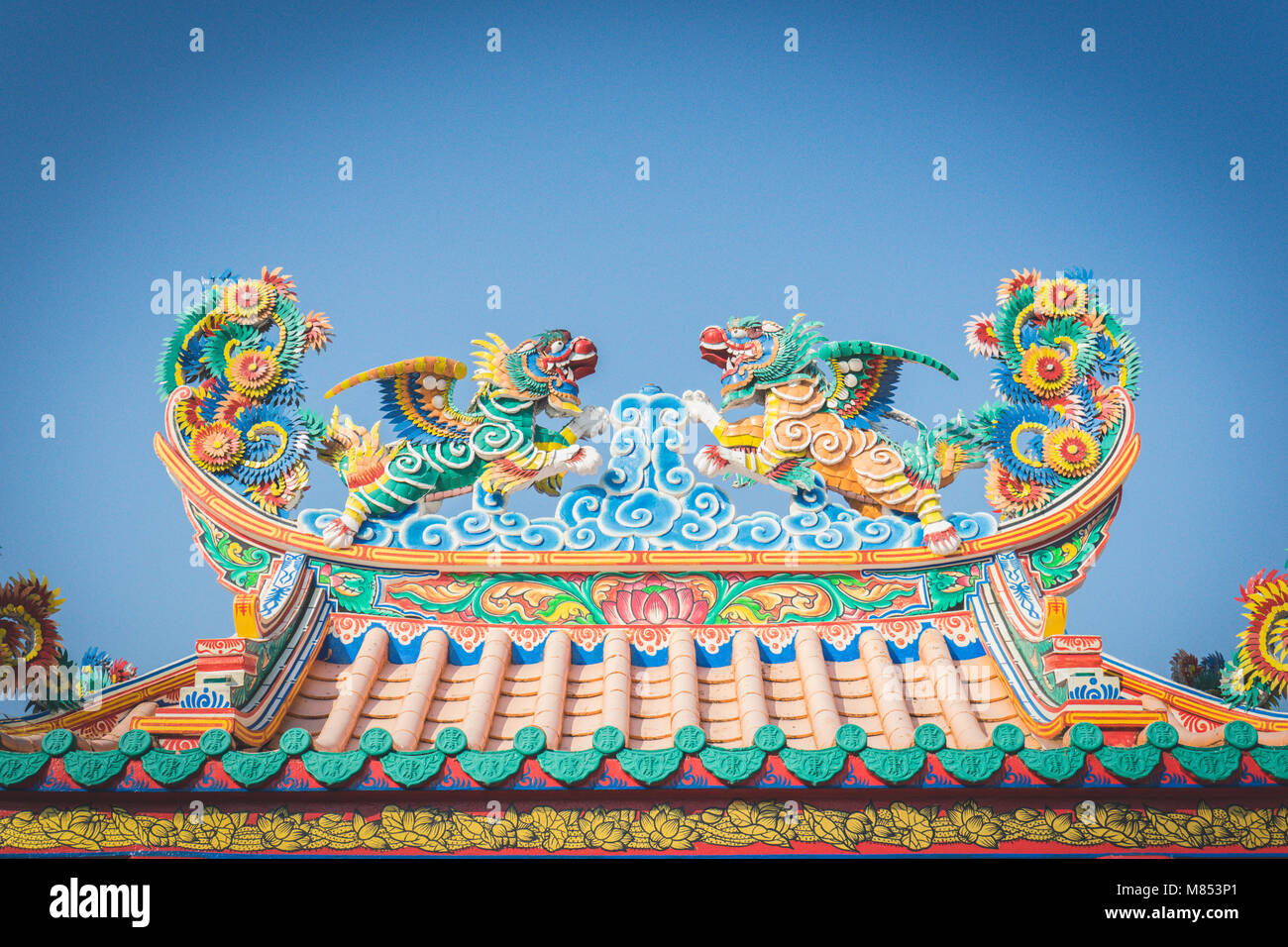 Colorful dragon column at Chinese shrine soars into blue sky Stock ...