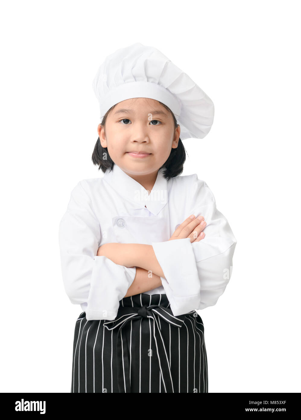 Portrait of cute girl chef with cook hat and apron stand and smile ...