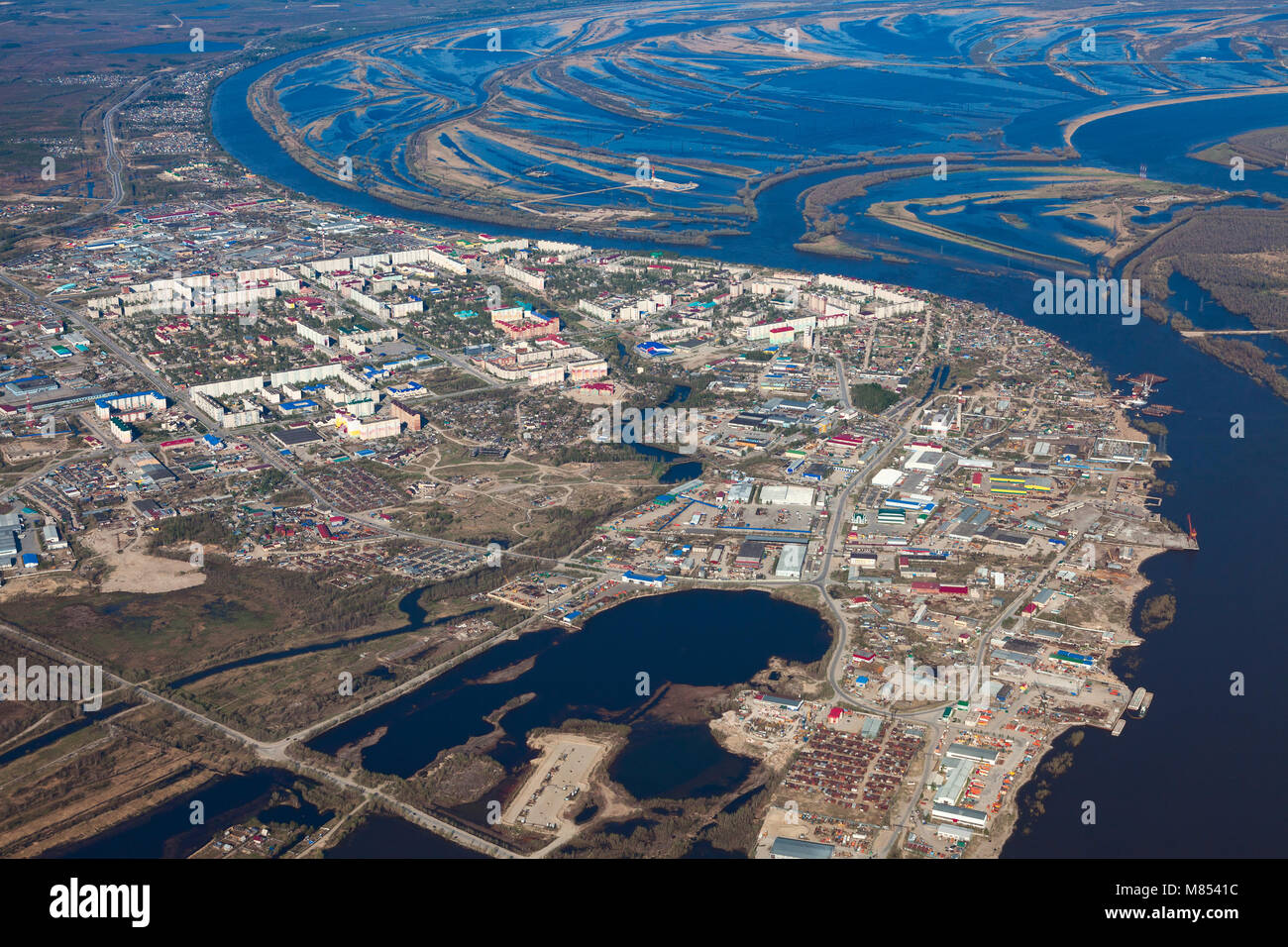 Aerial View of town on the bank river Stock Photo - Alamy