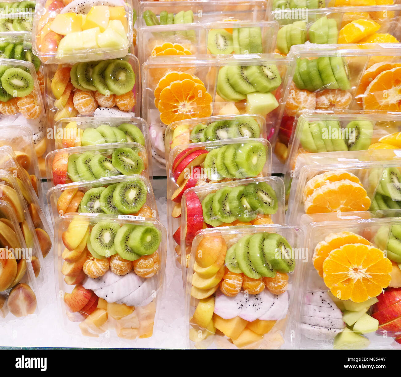 Fresh sliced fruits in plastic box Stock Photo - Alamy