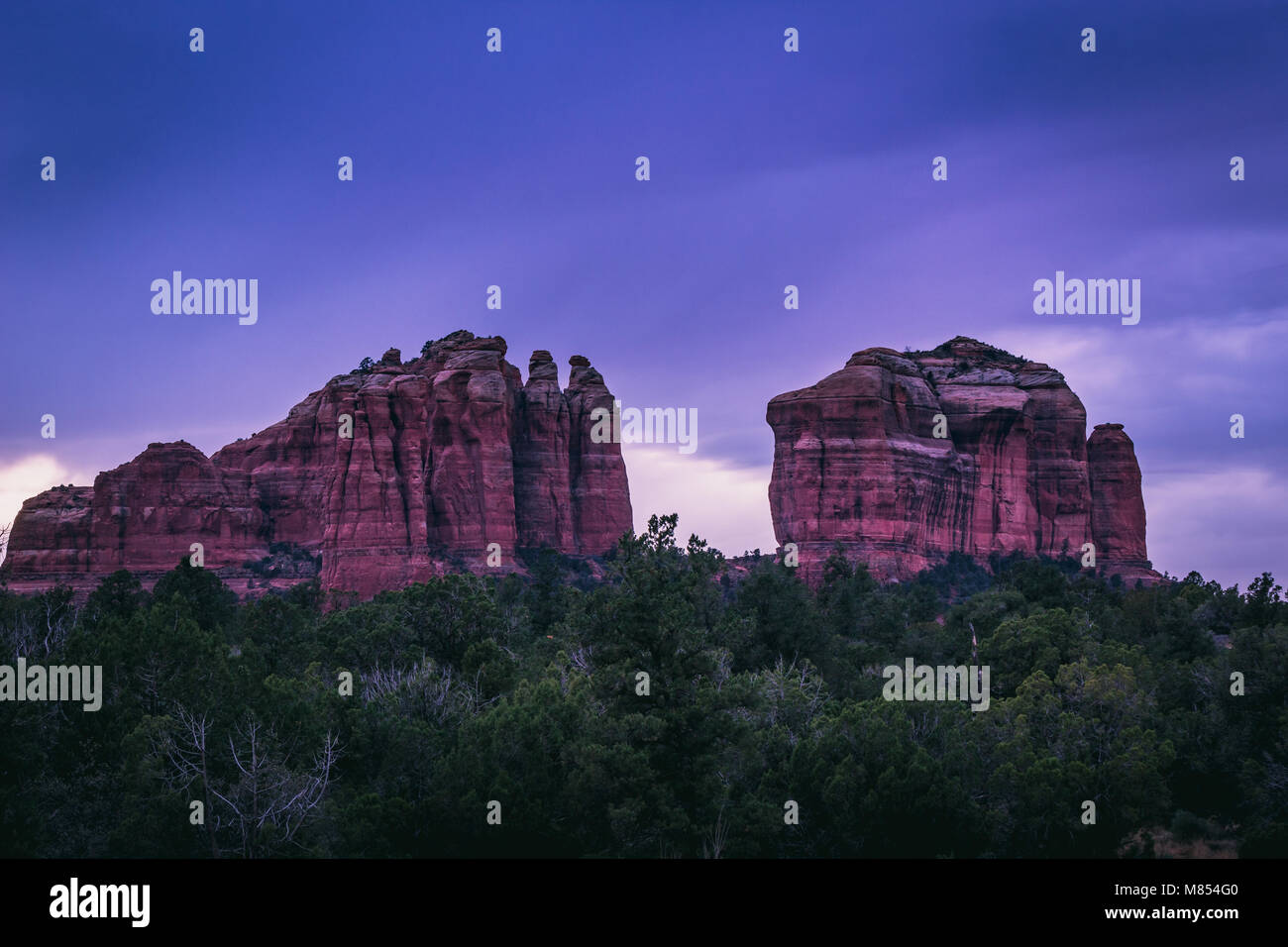 Beautiful Cathedral Rock formation with dramatic pink and purple sky at ...