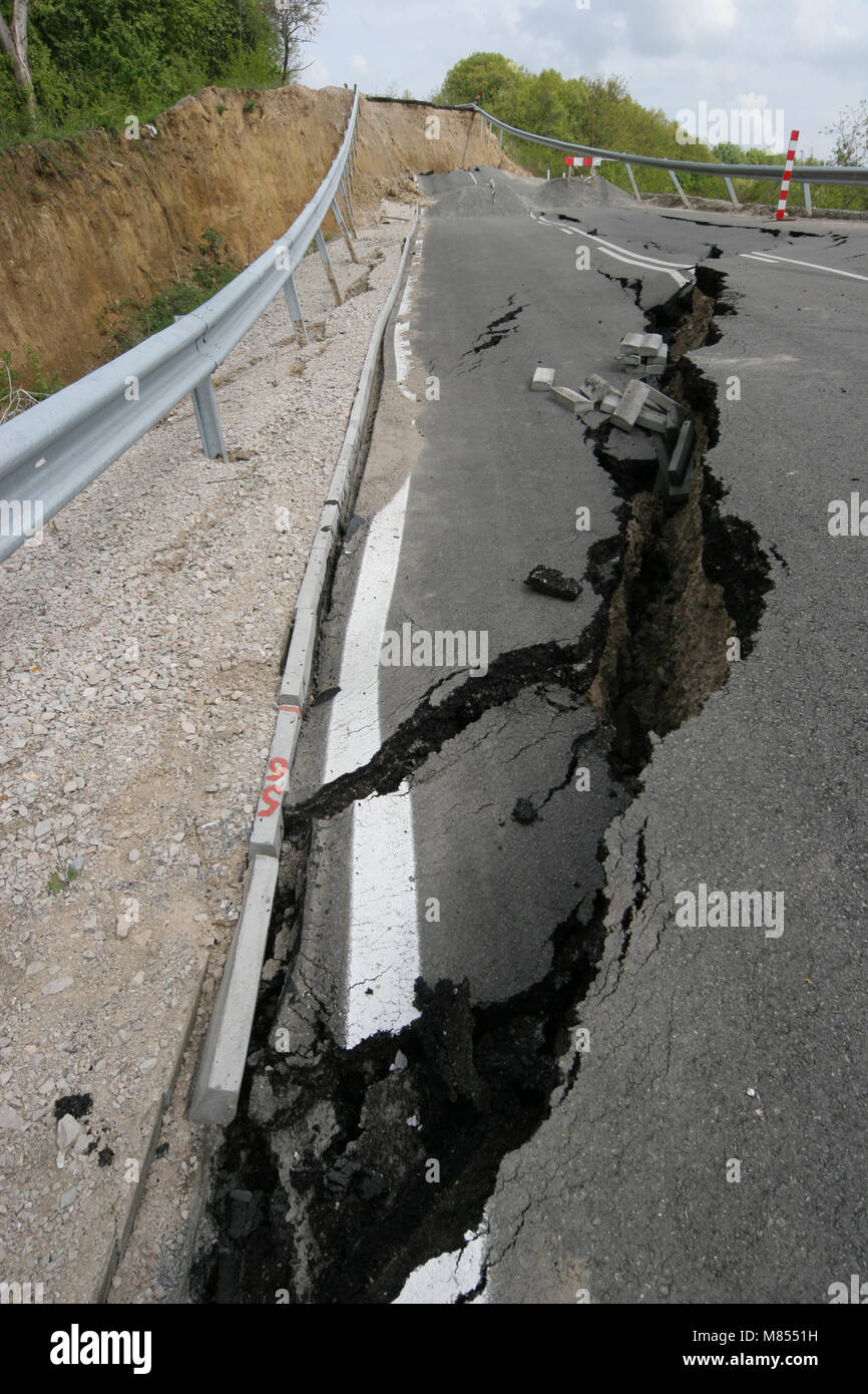 Road collapses with huge cracks. International road collapsed down ...