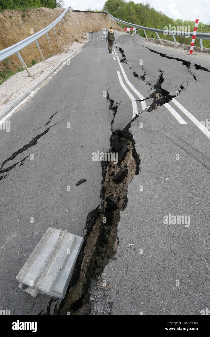 Road collapses with huge cracks. International road collapsed down ...