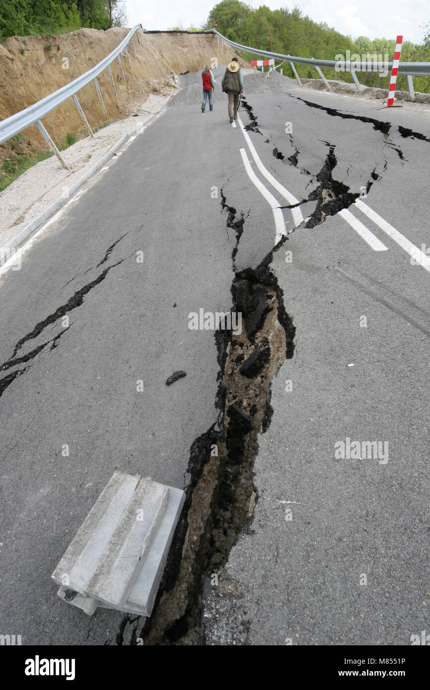 Road collapses with huge cracks. International road collapsed down ...