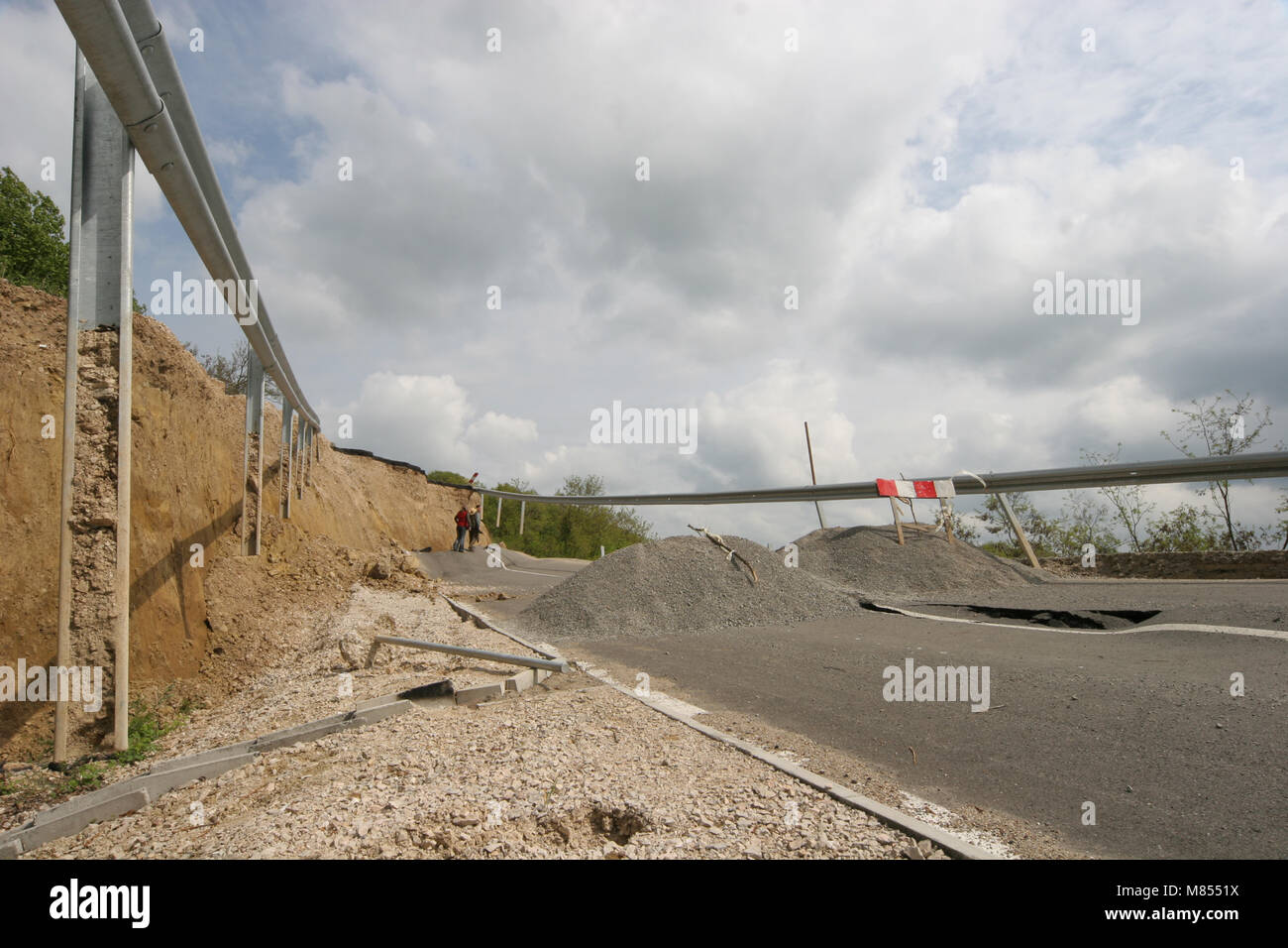 Road collapses with huge cracks. International road collapsed down ...