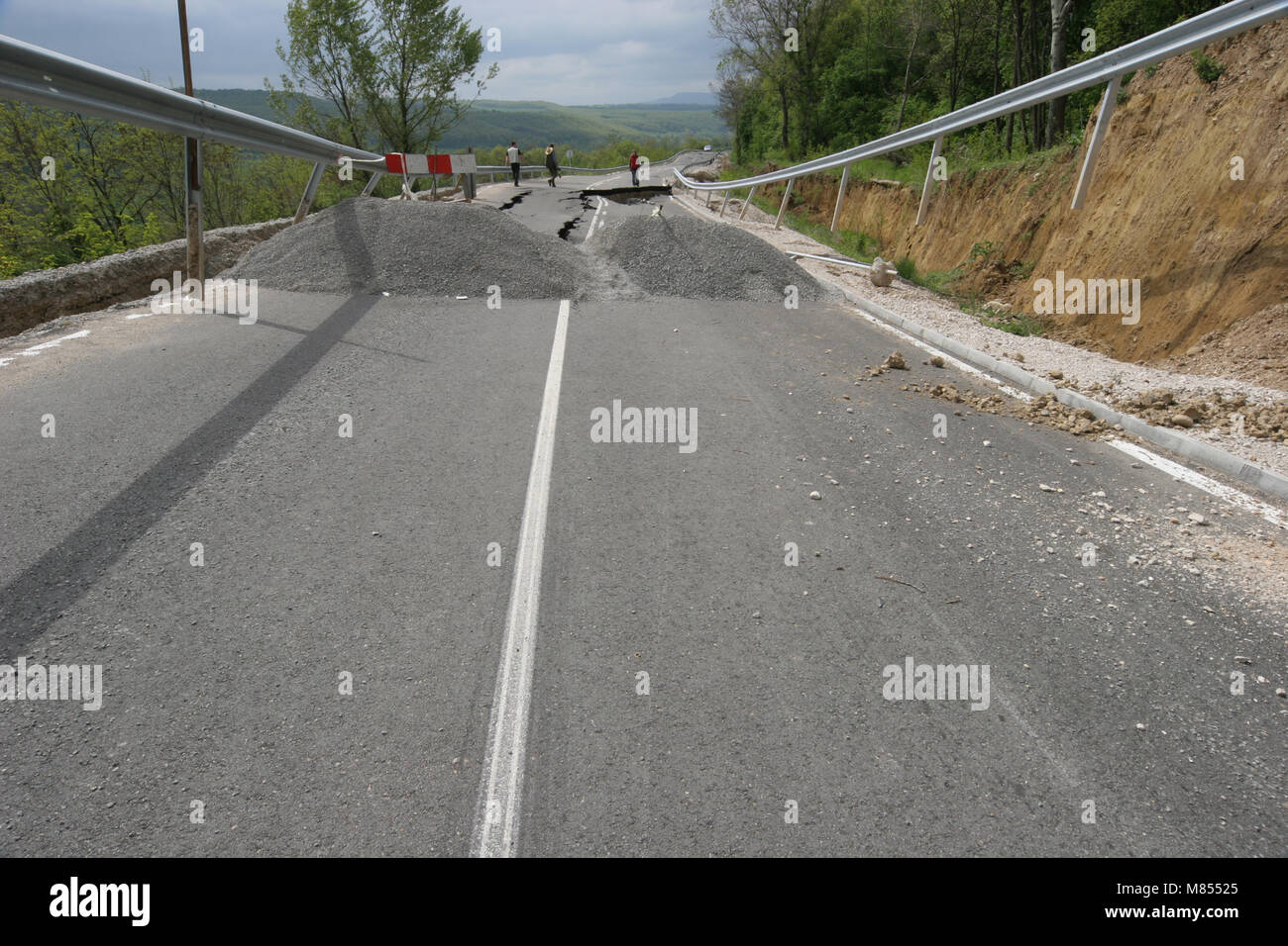 Road collapses with huge cracks. International road collapsed down ...