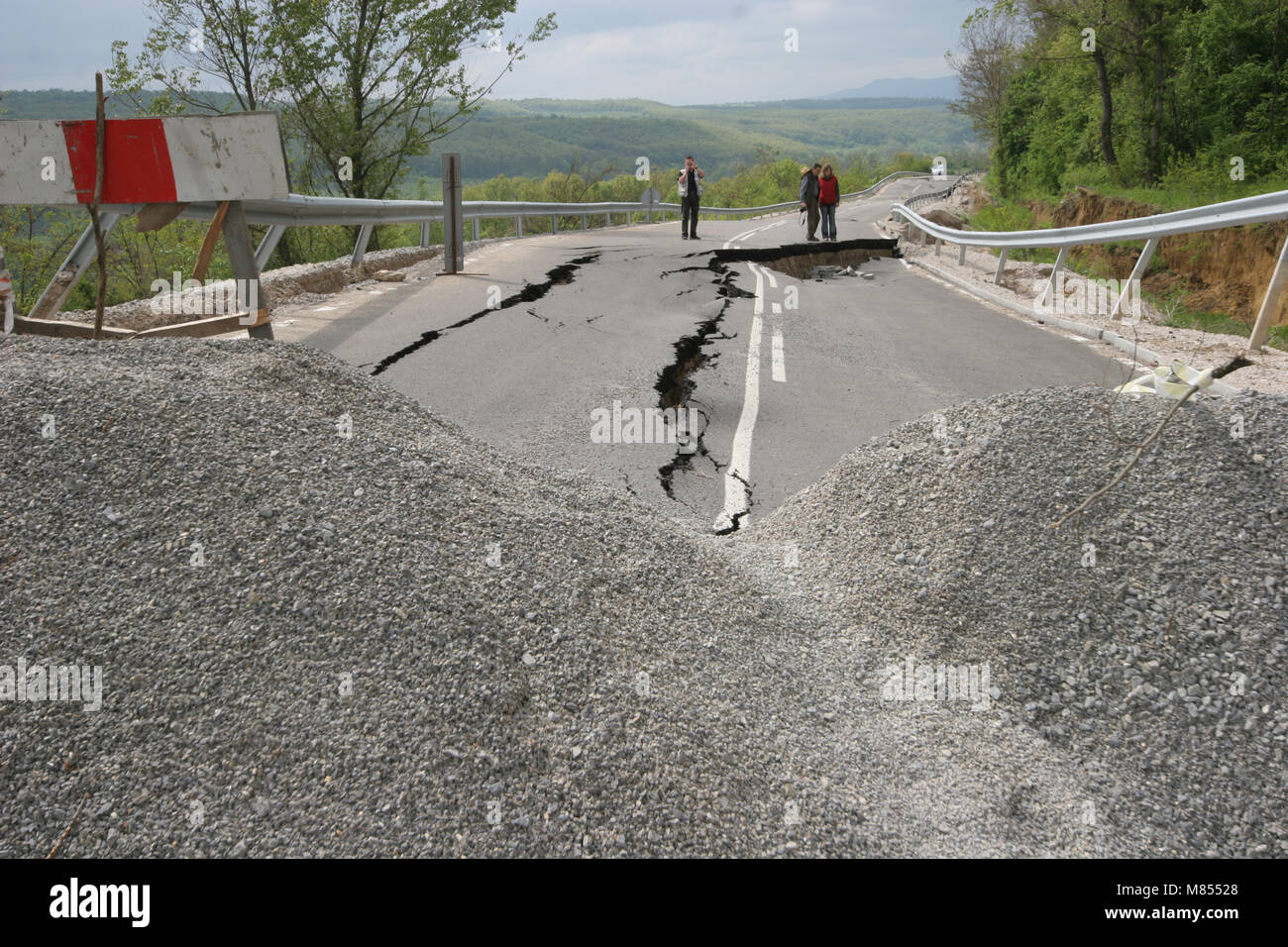Road collapses with huge cracks. International road collapsed down ...