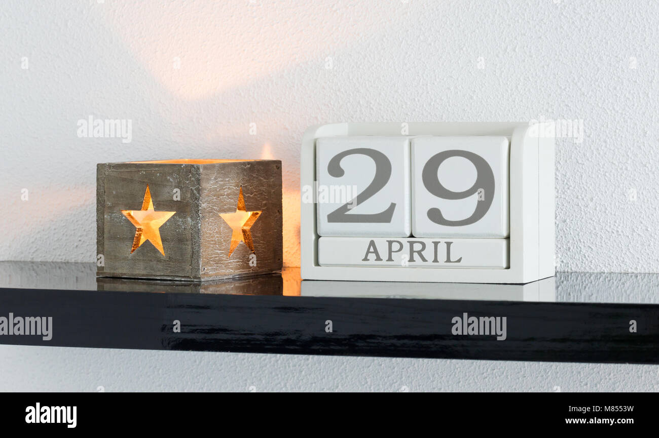 White block calendar present date 29 and month April on white wall ...
