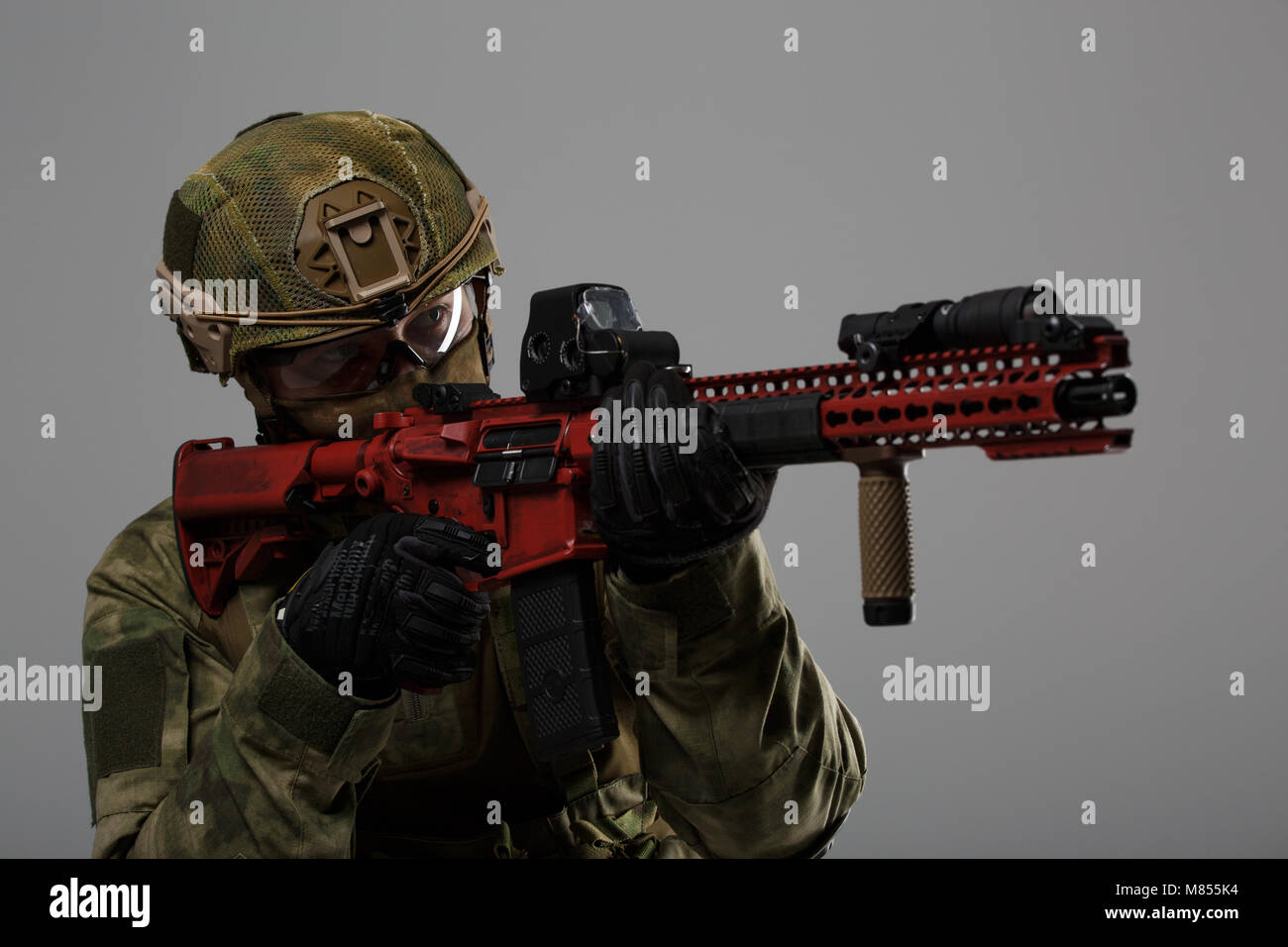 Picture of aiming military man in helmet with gun Stock Photo - Alamy