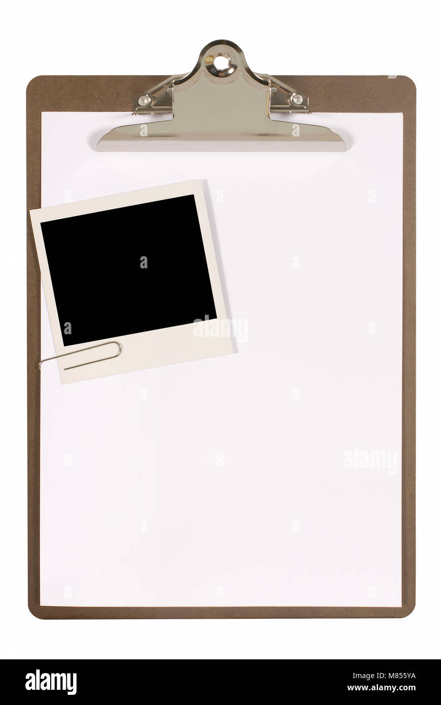 Ordinary clipboard with plain paper and an instant camera photo print ...